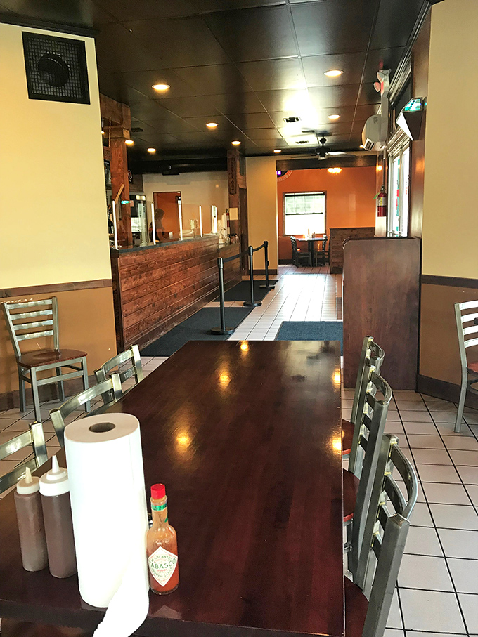 Inside, vibrant colors and neon lights create the perfect backdrop for culinary magic. Beach vibes meet serious cooking in this lively space.