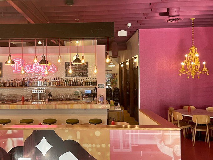 Pink walls, gold accents, and that chandelier &ndash; Baby's interior feels like your coolest friend's apartment, if that friend also made killer milkshakes.