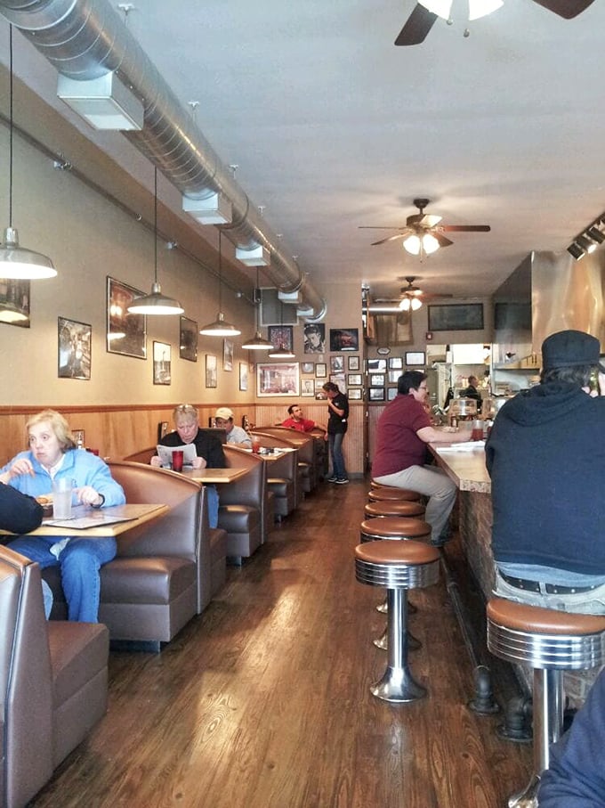 Inside The Mont, geometric blue walls and cozy booths create that rare atmosphere where both first dates and family reunions feel equally at home.