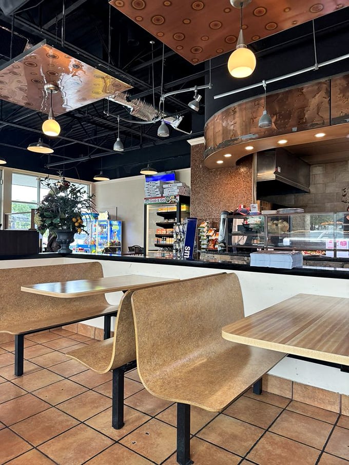 Modern industrial meets cozy comfort inside. Those copper ceiling panels add unexpected flair to a space that prioritizes what matters&mdash;the food.