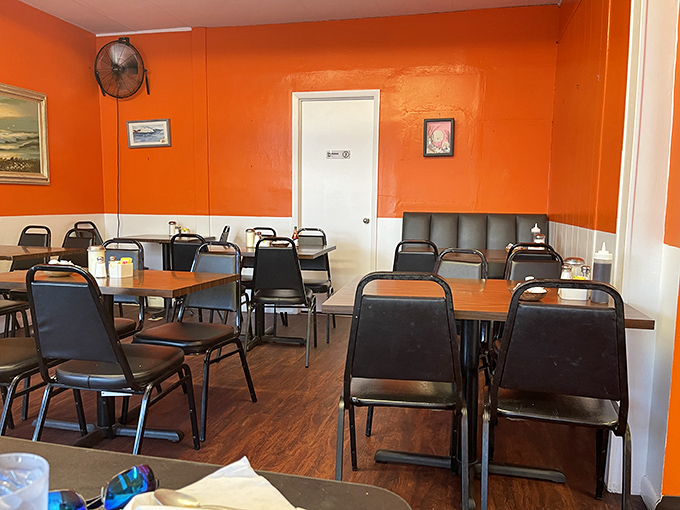Orange walls that could wake you up faster than the coffee. Simple tables and chairs say, "We're about the food, not fancy furniture."