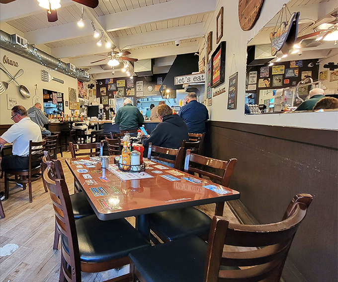 Inside, wooden tables, nostalgic wall decor, and that unmistakable "Let's Eat" sign create the perfect backdrop for breakfast magic to unfold.