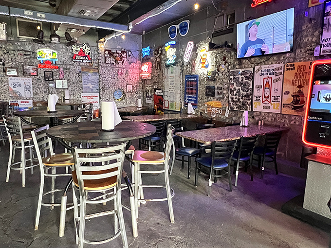 Dollar bills wallpaper and neon signs illuminate this former ice house, where simplicity reigns and pretension goes to die.