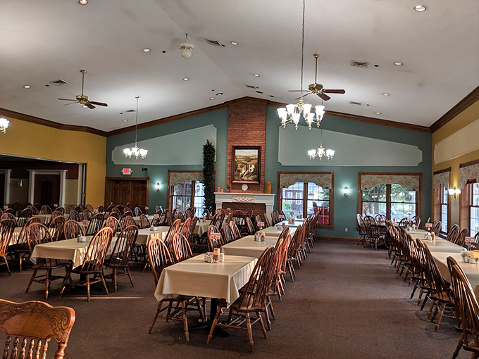 Windsor chairs and warm wood tones create that rare dining room magic: spacious yet cozy. The fireplace promises warmth beyond what's on your plate.