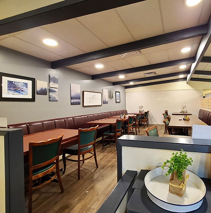 Cozy brown leather booths invite lingering conversations beneath coastal photographs. The kind of place where calories don't count and dessert is practically mandatory.