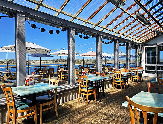Dining with a view! The covered deck offers panoramic harbor vistas that pair perfectly with whatever's on your plate.