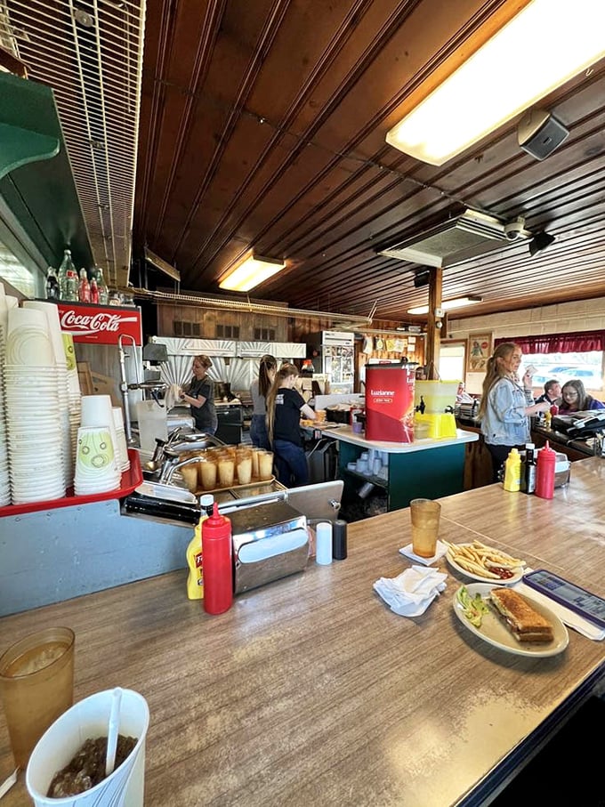 Inside, the wood-paneled ceiling and bustling counter create the kind of authentic atmosphere that corporate chains spend millions trying (and failing) to replicate.