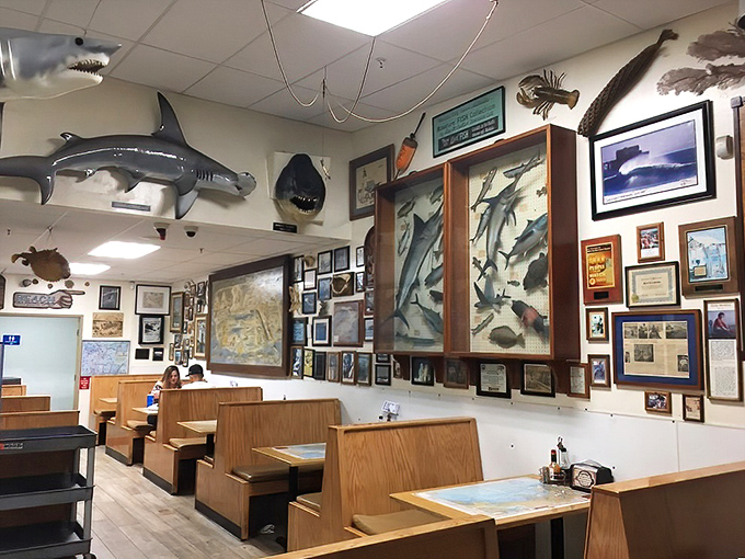 Cherry-red vinyl booths and wood-paneled walls create that perfect time capsule atmosphere where the decor hasn't changed because the barbecue never needed to.
