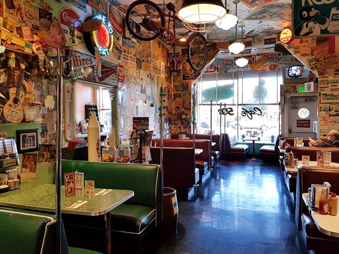 Step inside and be enveloped by walls plastered with authentic memorabilia—where every inch tells a story and every booth holds the promise of comfort food.