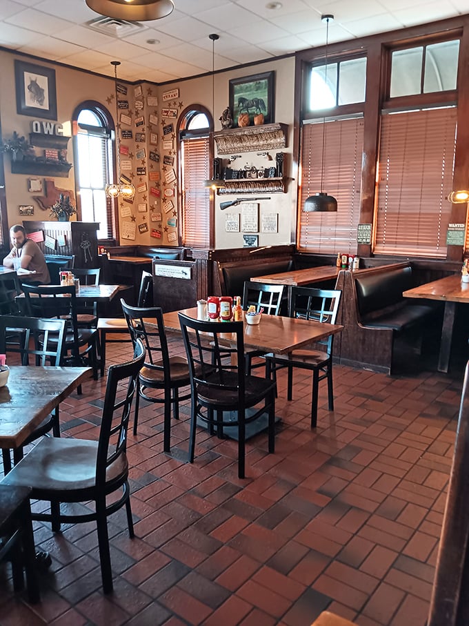 Wooden booths, terracotta floors, and walls adorned with Western memorabilia create the perfect backdrop for serious breakfast contemplation.