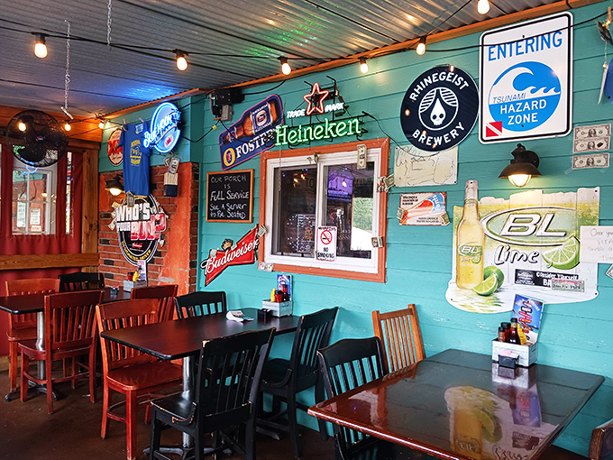 Turquoise walls adorned with beer signs and a "Tsunami Hazard Zone" warning &ndash; because nothing says authentic seafood like coastal-themed irony 500 miles from the ocean.