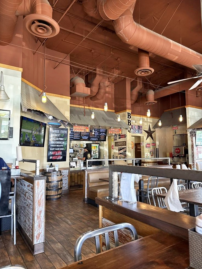 Industrial chic meets smokehouse authenticity. Those exposed ducts aren't just for show&mdash;they're carrying the intoxicating aroma of slow-smoked heaven.