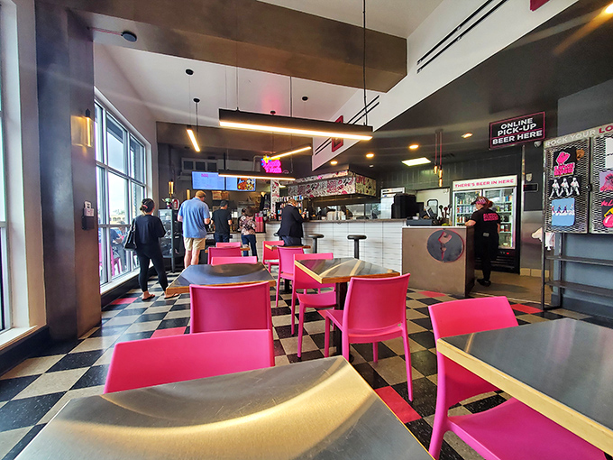 Modern meets comfort in this stylish interior where hot pink chairs aren't just a design choice&mdash;they're fair warning about the heat levels ahead.