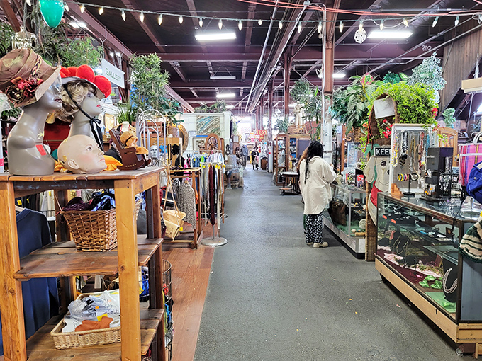 Mannequin heads sporting vintage hats watch over aisles packed with curiosities. It's like a museum where everything's for sale.