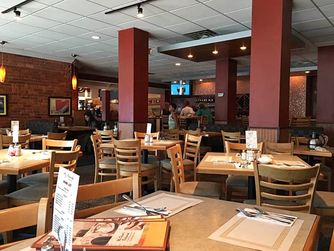 Inside, exposed brick walls and burgundy columns create that perfect balance of "been here forever" and "let's stay awhile" vibes.
