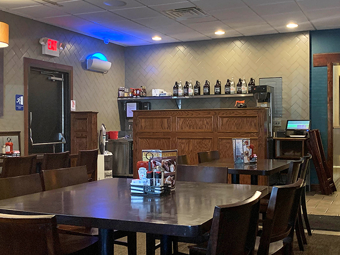 Inside, herringbone-patterned tile walls and warm wood tones create that perfect balance of modern touches with classic diner comfort.