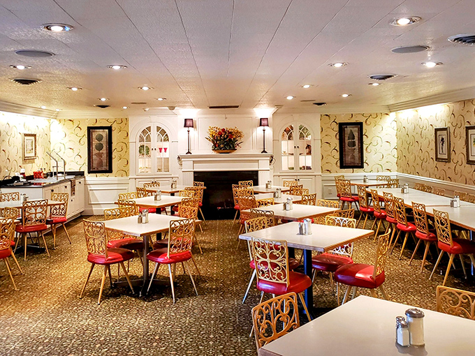 Step into a time capsule where red vinyl chairs and ornate gold metalwork create the perfect backdrop for comfort food conversations. The fireplace says "stay awhile."