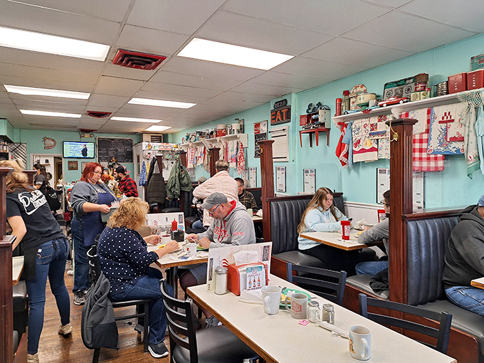 Inside, nostalgia isn't just served&mdash;it's the main course. The turquoise walls and vintage decor create the perfect backdrop for breakfast magic.