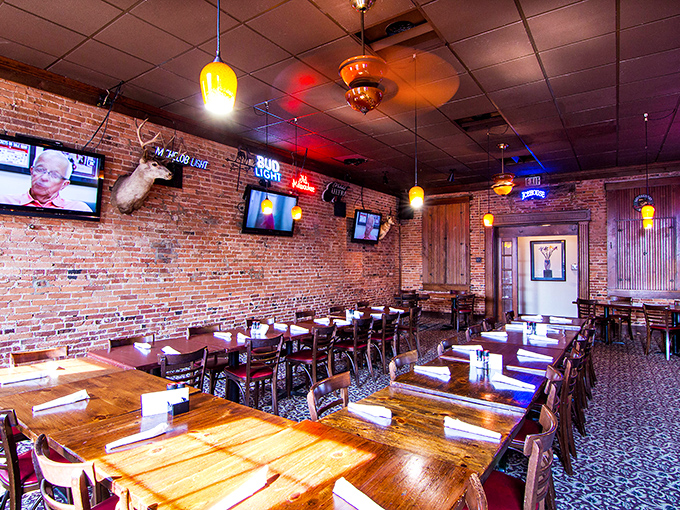 Exposed brick walls, warm lighting, and wooden tables create that rare atmosphere where both first dates and family reunions feel equally at home.