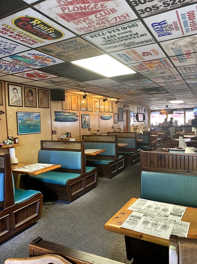 Those turquoise booths have heard more fish tales than a maritime museum, each one absolutely true.