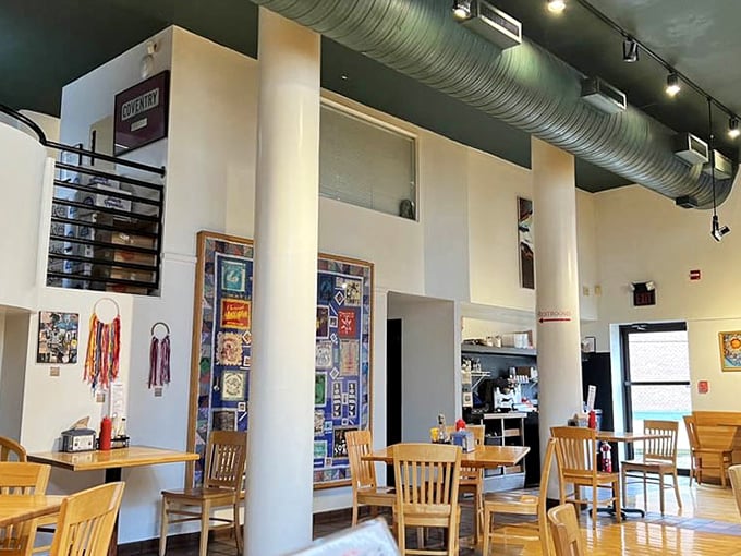 High ceilings, wooden tables, and local artwork create the perfect backdrop for comfort food conversations and neighborhood gatherings.