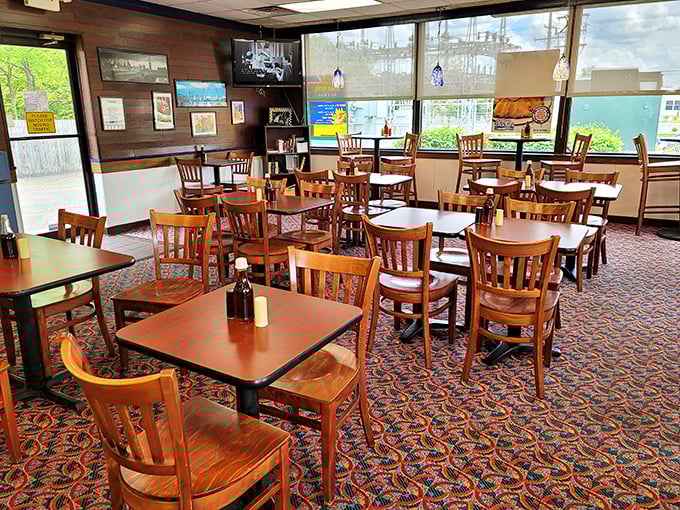 Wooden chairs, patterned carpet, and natural light create the perfect backdrop for seafood indulgence&mdash;casual dining at its unpretentious best.