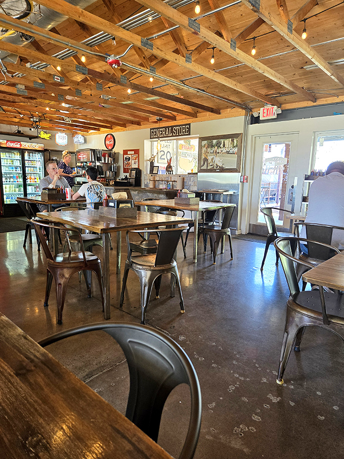 Wooden ceiling beams, metal chairs, and that "General Store" sign create the perfect unpretentious backdrop for the serious business of BBQ appreciation.