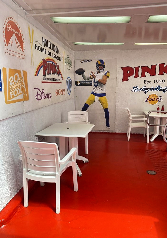 Hollywood royalty adorns these walls, but the real stars are the hot dogs that have kept this place in business for generations.