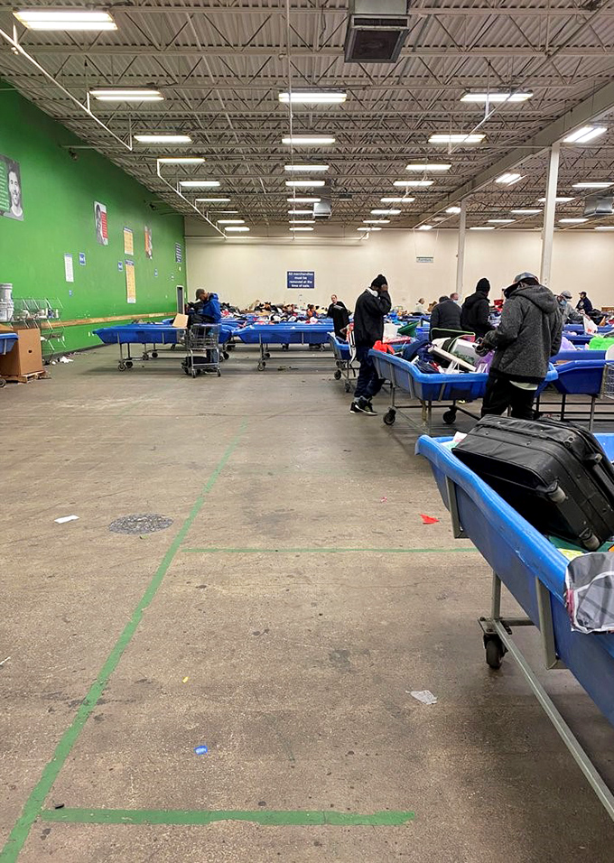 Rows of blue bins stretch endlessly, creating a bargain hunter's paradise that rivals any casino floor.
