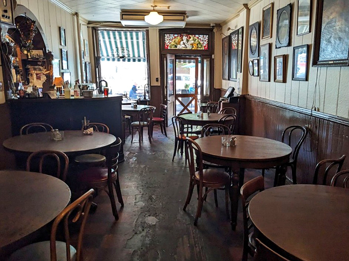 Step inside and time travel happens instantly. These worn wooden tables have supported countless elbows, beer glasses, and life-changing conversations across generations.