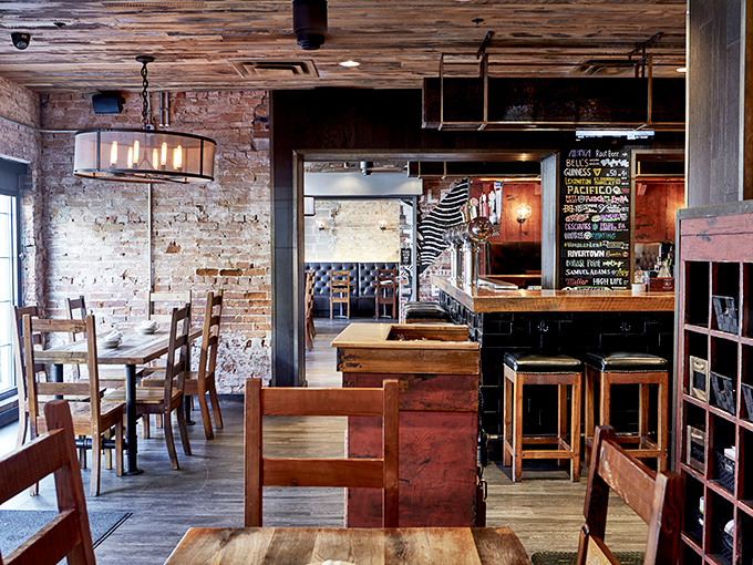 Exposed brick walls and wooden beams create that perfect sweet spot between "trendy restaurant" and "your coolest friend's dining room."
