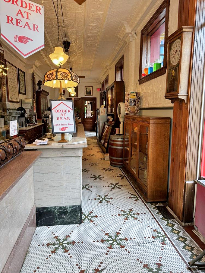 Step inside and the modern world vanishes. That hexagonal tile floor has witnessed generations of ice cream lovers shuffling forward in sweet anticipation.