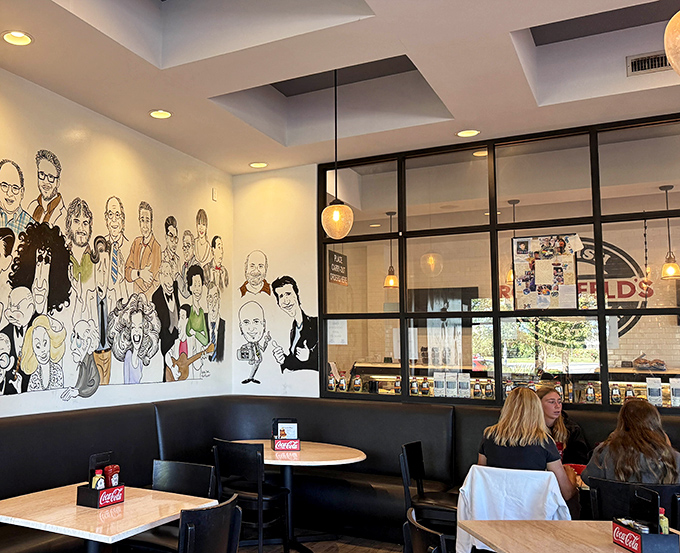 Inside, caricature murals and cozy black booths create that perfect "I've just discovered the neighborhood's best-kept secret" atmosphere.