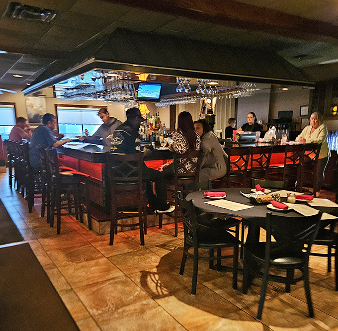 The heart of Italian hospitality beats at this inviting bar where locals gather, glasses clink, and the evening's possibilities unfold in warm conversation.