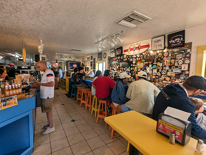Inside, walls plastered with stickers and memorabilia tell stories of satisfied pilgrims who've made the journey to this temple of seafood delights.