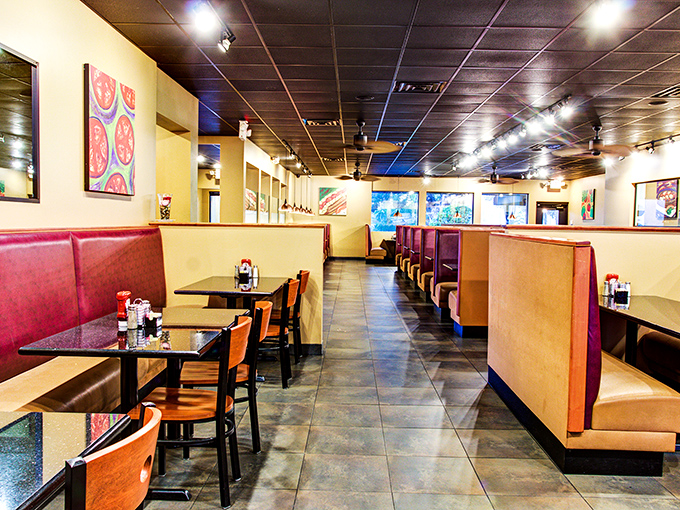 Red booths and warm lighting create the perfect backdrop for morning conversations. Breakfast ambiance that says "stay awhile" without saying a word.