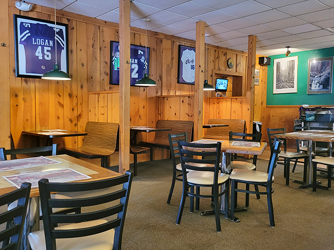 Local sports memorabilia adorns warm wood-paneled walls, creating that perfect "everybody knows your name" vibe that chain restaurants spend millions trying to replicate.
