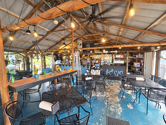 Rustic wooden beams, string lights, and that painted blue floor create the kind of authentic charm money can't buy but memories are made of.