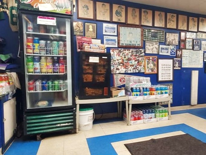 The wall of memories tells you everything: this isn't just a sandwich shop, it's a community time capsule with cold drinks on standby.