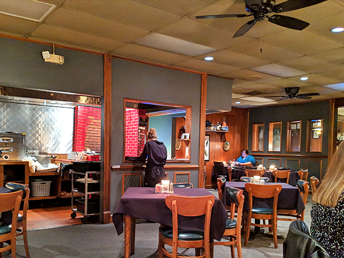 Where magic happens: The cozy interior blends wood paneling and comfortable seating, creating that perfect "I'm about to have an amazing steak" atmosphere.