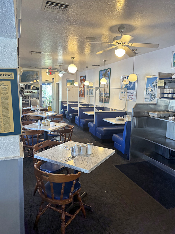 Classic diner charm with a Hellenic twist&mdash;blue booths, wooden chairs, and subtle Greek decor create the perfect backdrop for culinary magic.