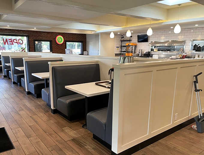 Slide into these comfortable booths where nostalgia meets modern comfort. The wood floors and pendant lighting create the perfect backdrop for memorable meals.