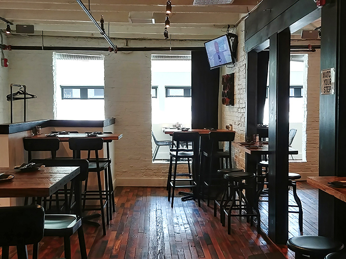 Industrial-chic meets cozy comfort in this thoughtfully designed space. Those wooden floors have witnessed countless "oh my god, you have to try this" moments.