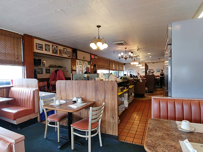Classic diner aesthetics at their finest&mdash;salmon-colored booths, wooden dividers, and lighting that makes everyone look like they've just returned from vacation.