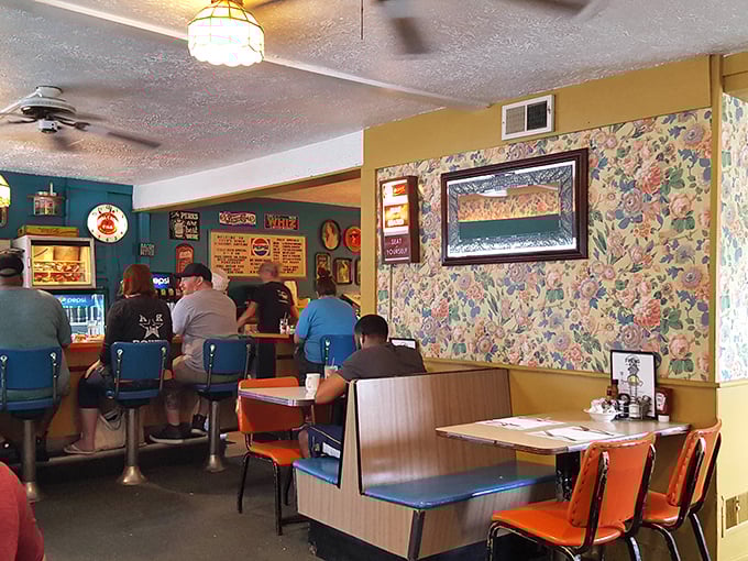 Step inside and time stands still&mdash;floral wallpaper, turquoise walls, and orange vinyl booths create the perfect symphony of classic Americana diner charm.