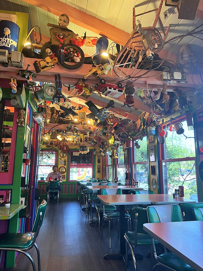 Dining beneath a ceiling of vintage toys feels like eating inside a childhood dream. Every inch of space hosts another conversation piece.