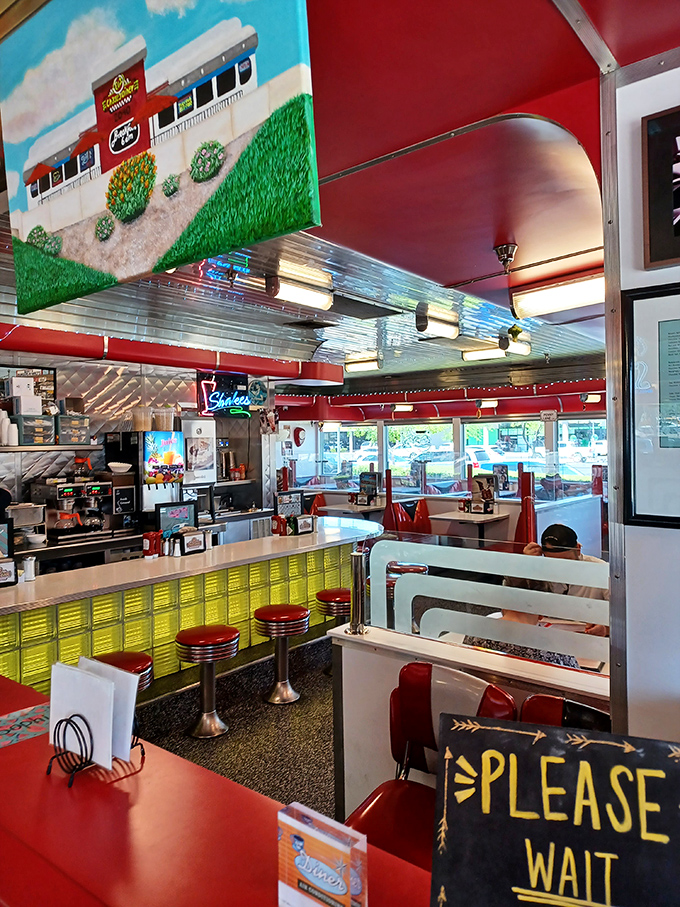Step inside and you're transported to the golden age of diners, complete with counter seating and that unmistakable "Please Wait" sign.