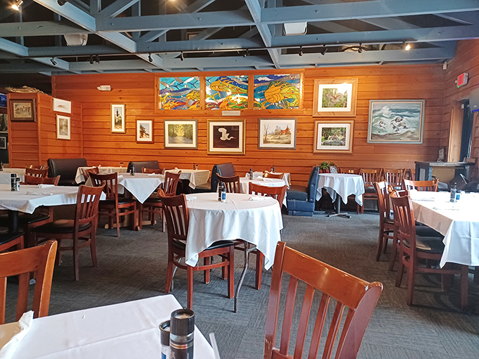 Warm wooden walls adorned with local artwork create the perfect backdrop for seafood indulgence. Like dining in a tasteful fishing cabin.
