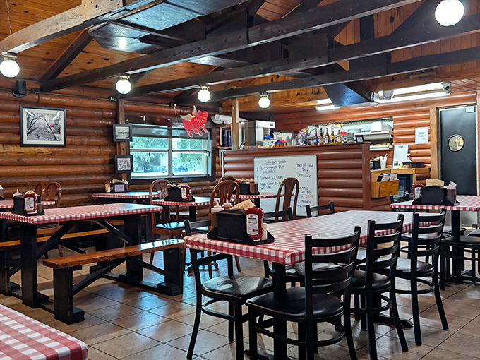 Red-checkered tablecloths and exposed wooden beams create the perfect backdrop for the barbecue drama about to unfold on your plate.