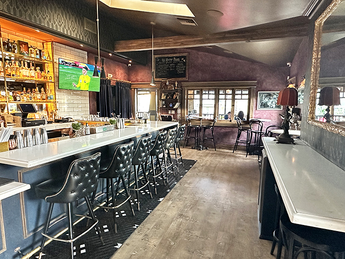 The bar area strikes that perfect balance between "fancy night out" and "I can actually relax here" with its quilted leather stools and warm lighting.